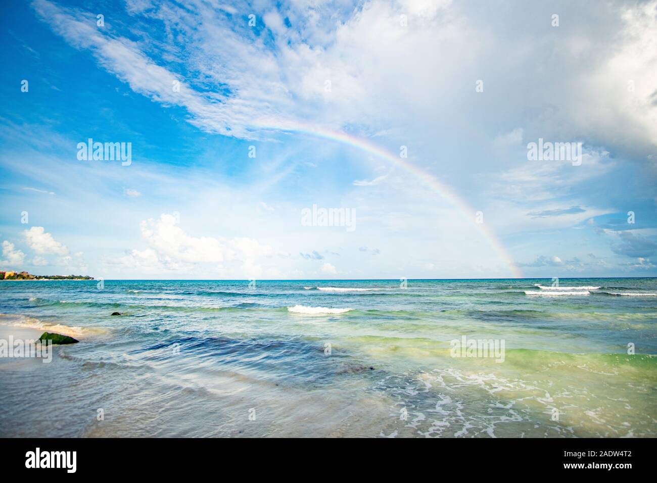Half Rainbow and beautiful sky at the beach Stock Photo - Alamy