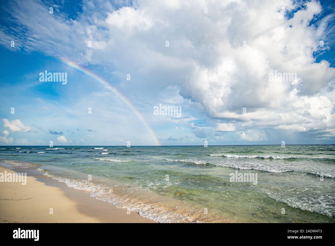 Half Rainbow and beautiful sky at the beach Stock Photo - Alamy