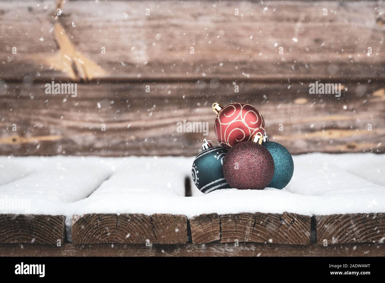 Christmas composition with balls and falling snow Stock Photo - Alamy