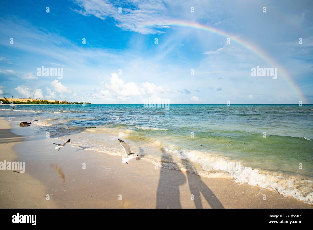 Half Rainbow and beautiful sky at the beach Stock Photo - Alamy