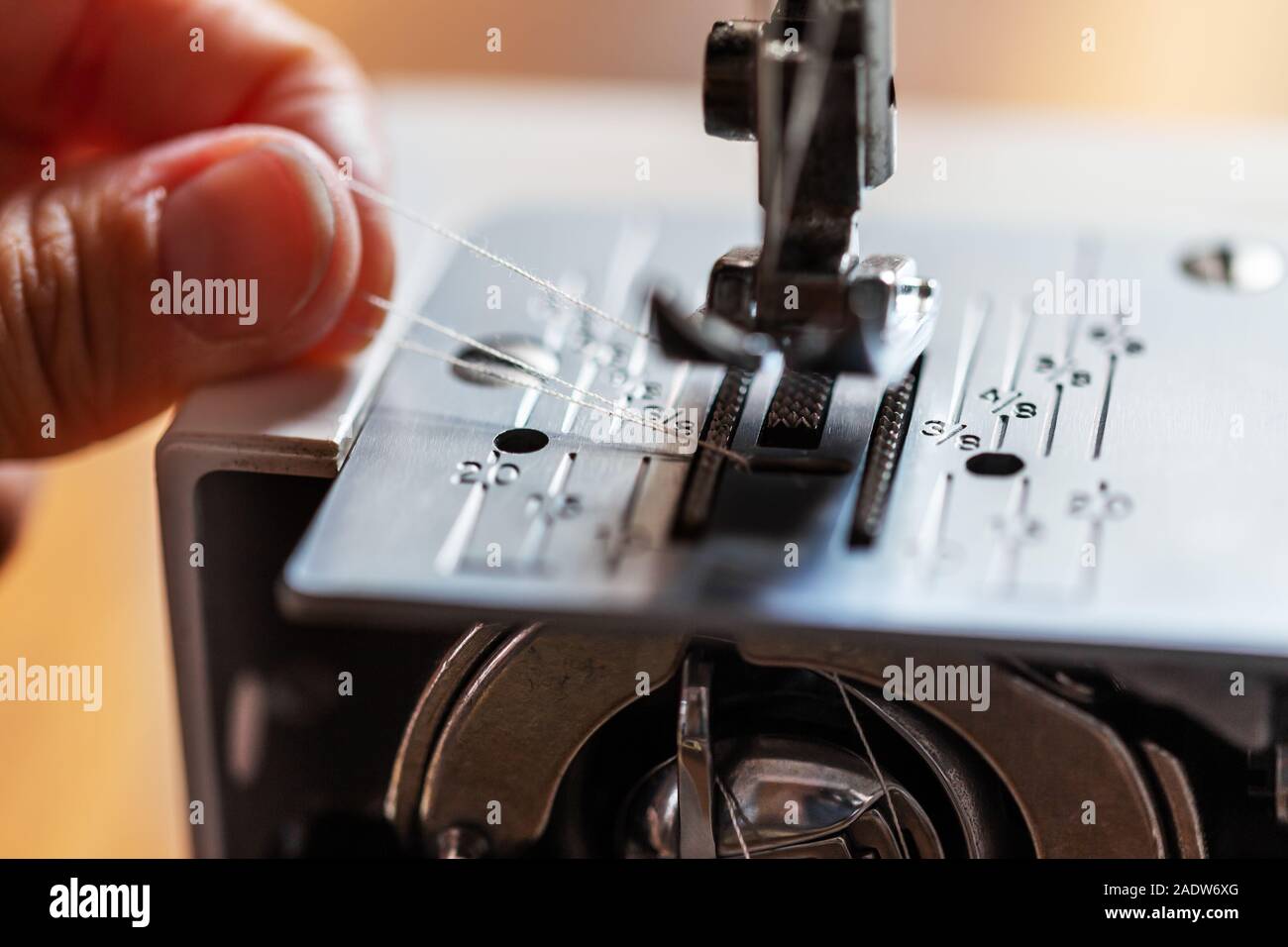 Threading a sewing machine hi-res stock photography and images - Alamy