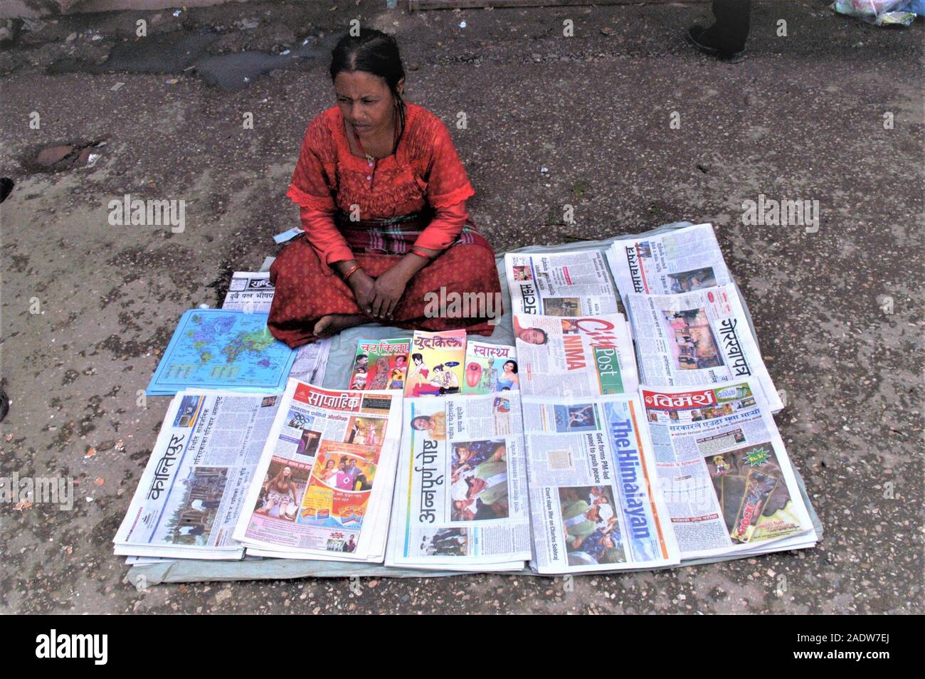 A NEWSPAPER SELLER IN A STREET IN THE HISTORIC CENTER Stock Photo - Alamy