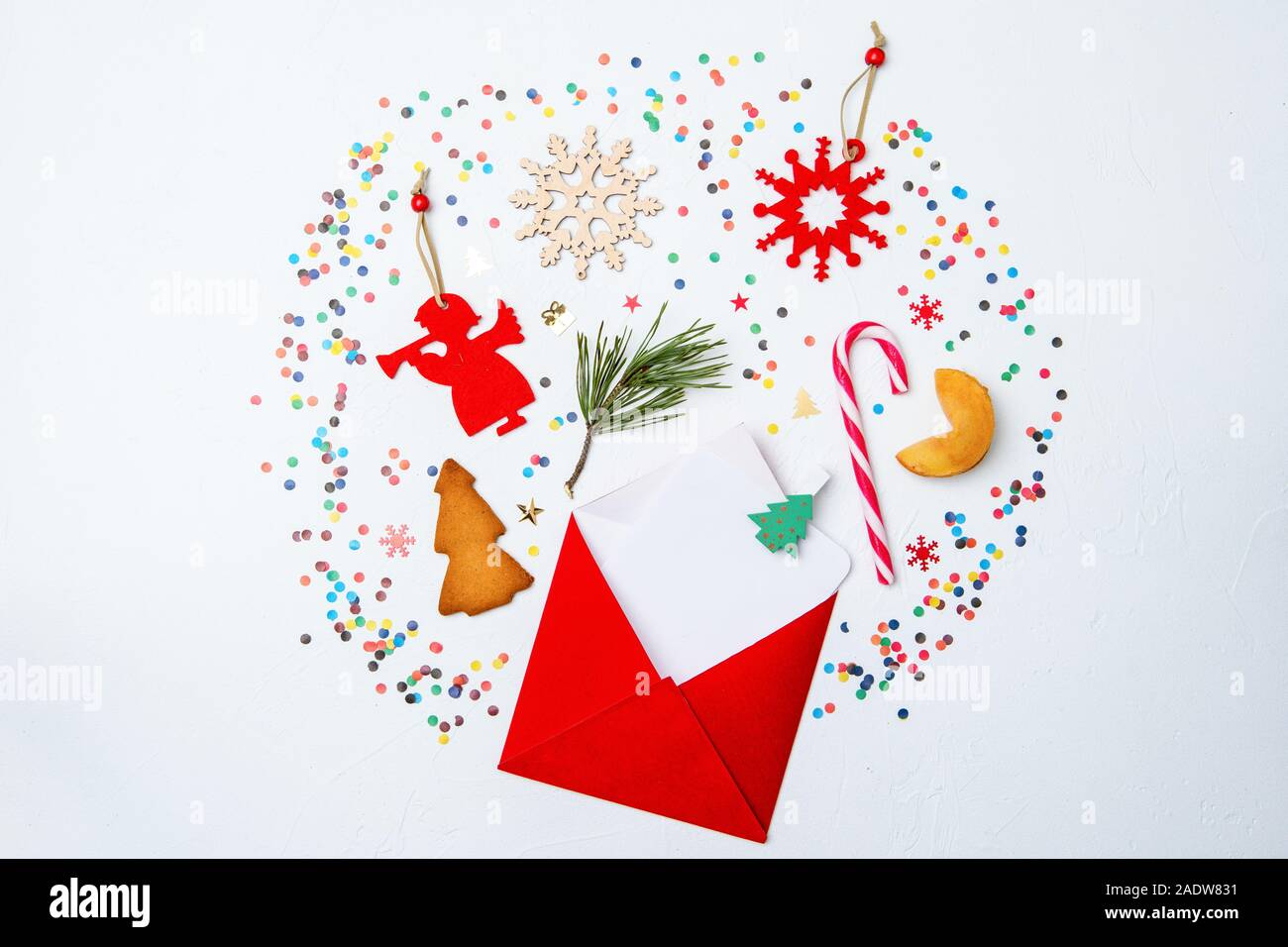 Image of red envelope, cookies, christmas decoration on empty white ...