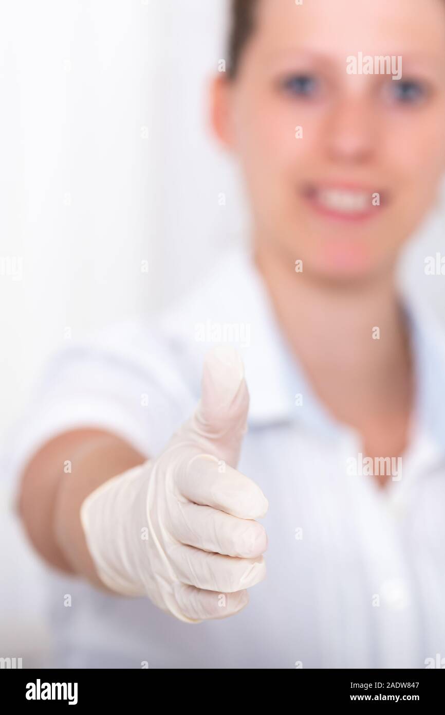 Female nurse or doctor is holding the hand for a handshake to the ...