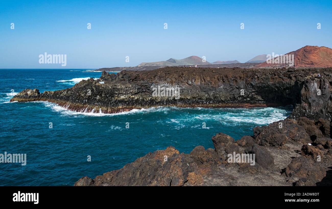 Tourists visiting popular tourist attraction "Los Hervideros", the ...