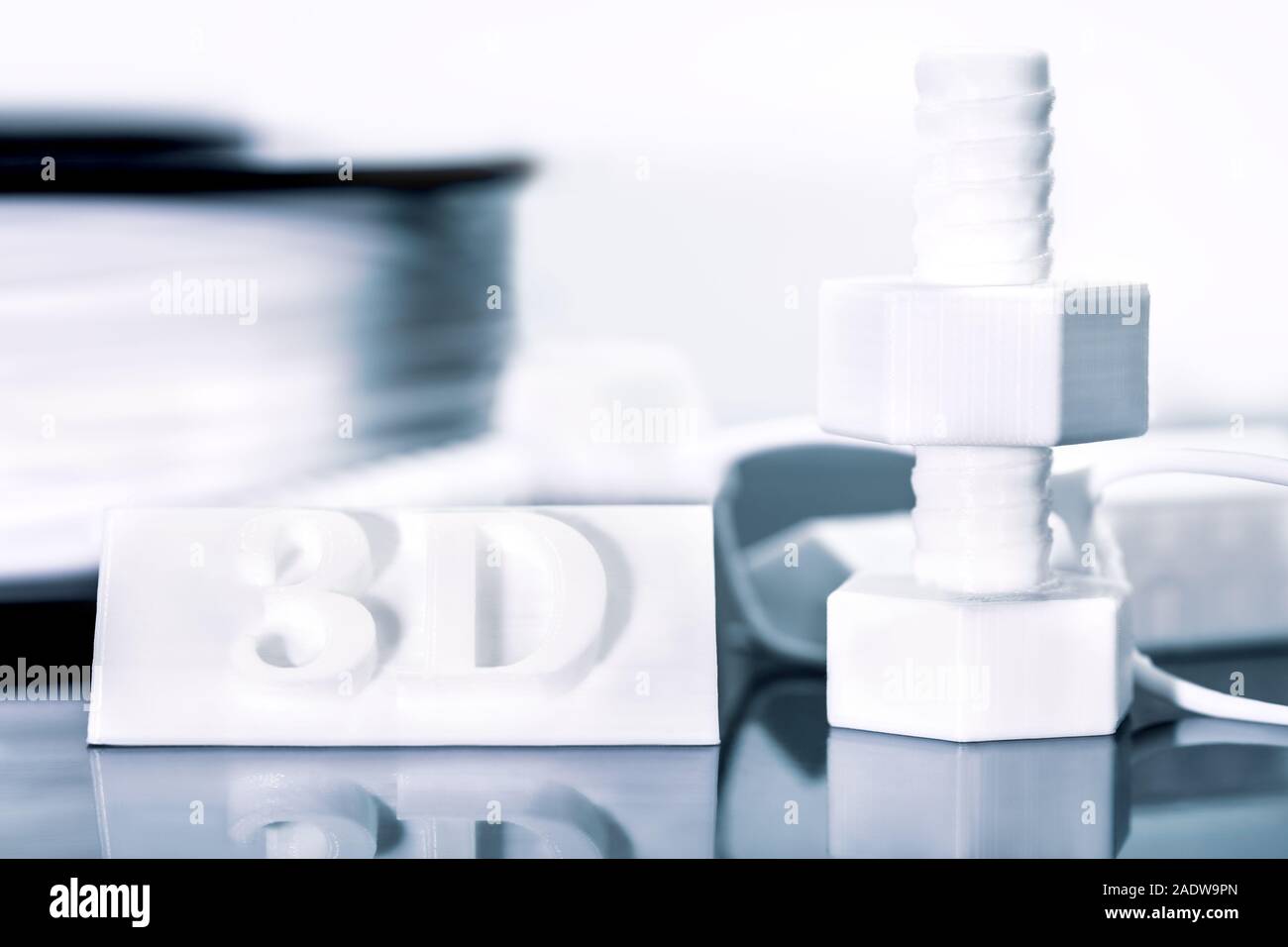 Various filament models from a 3D printer with reflection against a ...