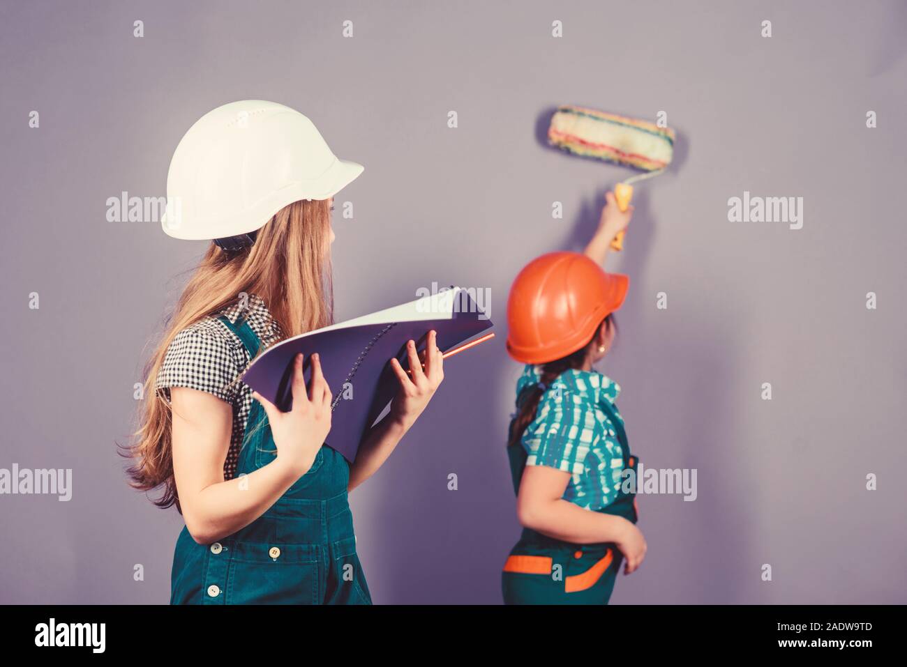 Sisters happy renovating home. Home improvement activities. Renovation ...