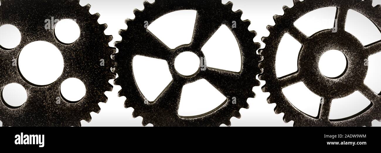 three gears in front of white background, concepts like teamwork or ...