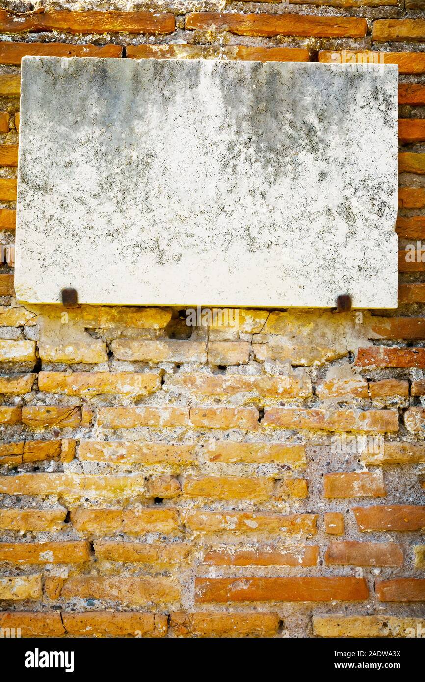 Vintage marble sign on brick wall, patina on surface Stock Photo - Alamy