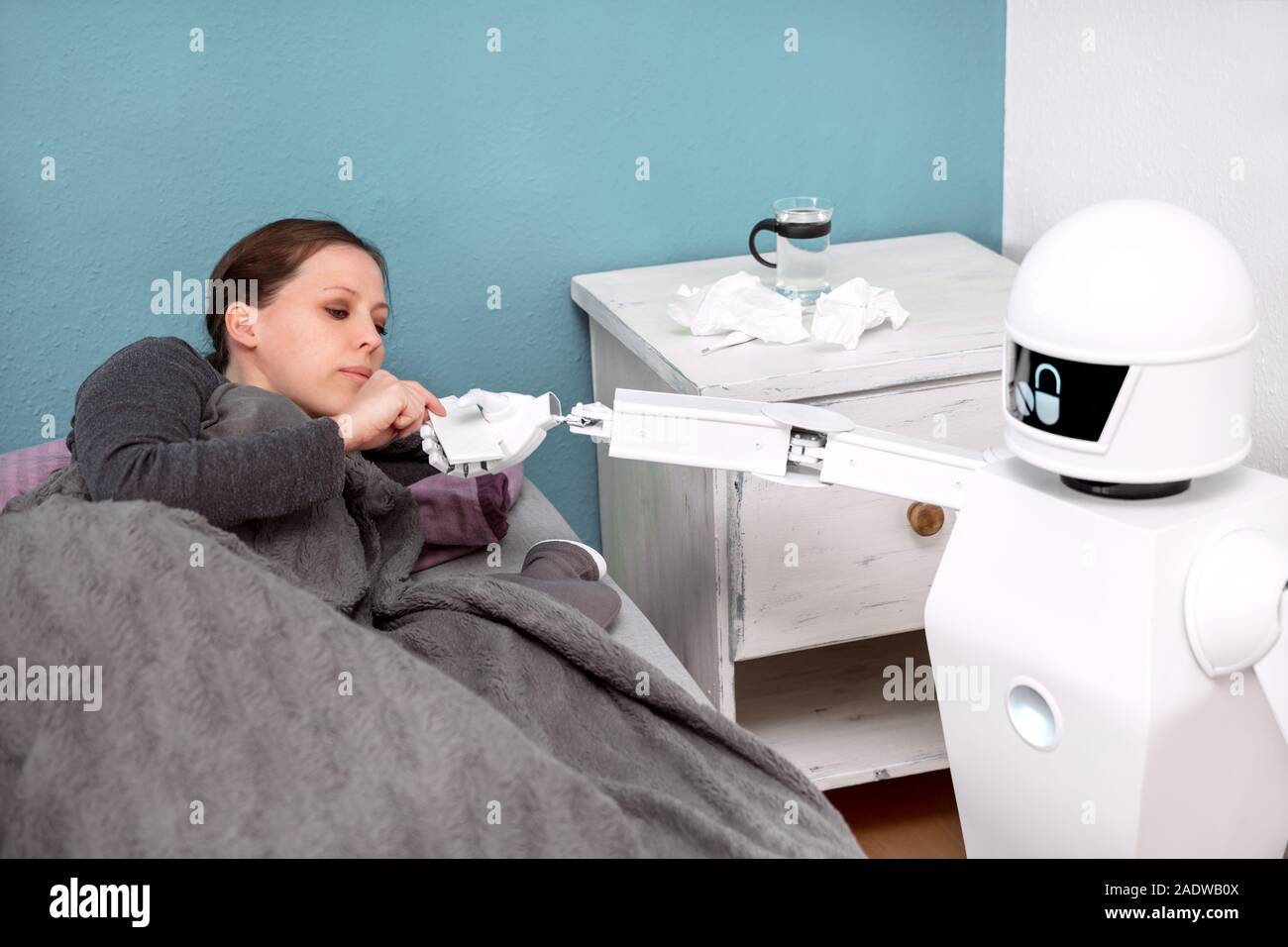 Medicine robot is helping a female patient, working as caregiver ...