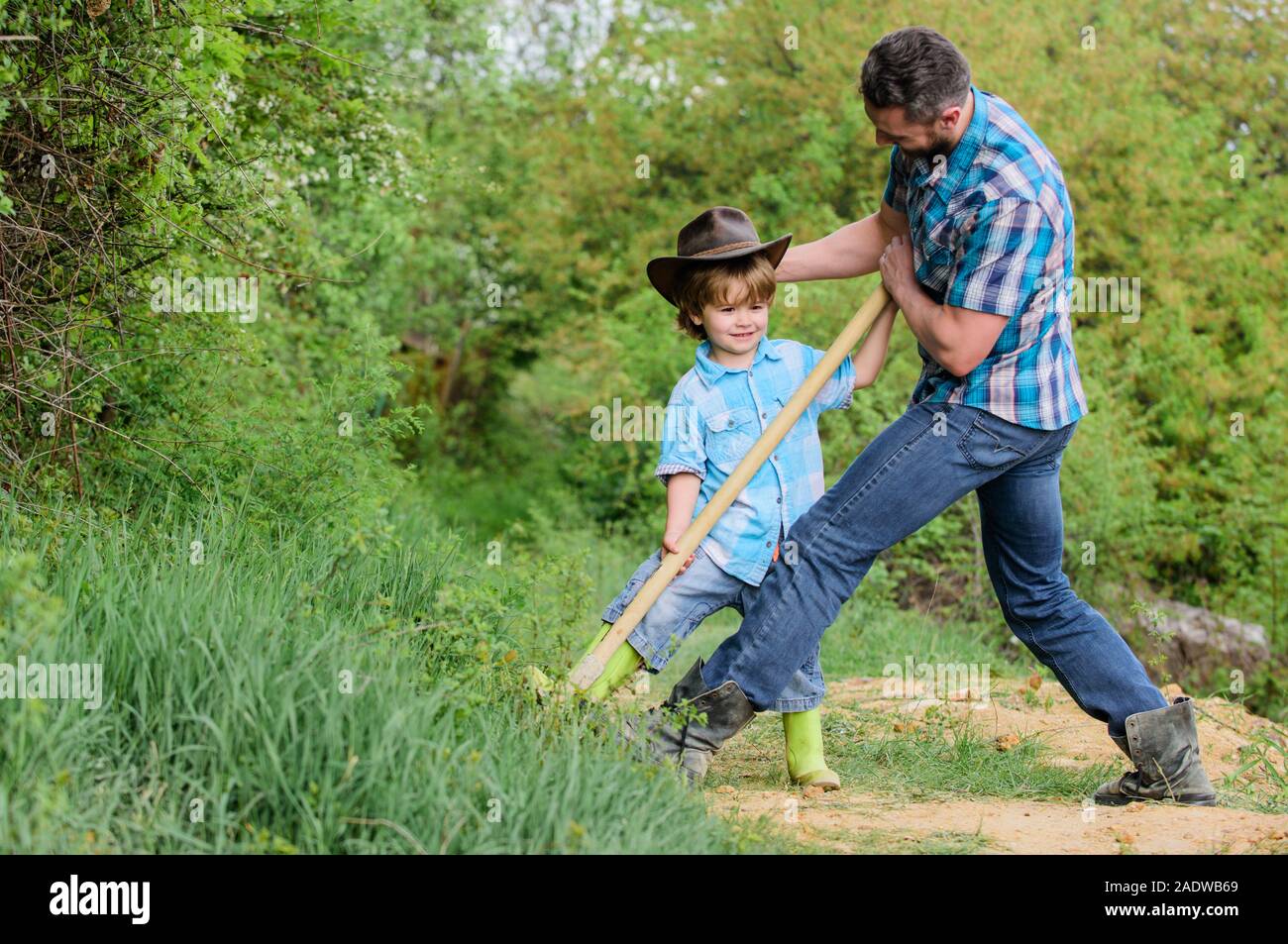 Find treasures. Little boy and father with shovel looking for treasures ...