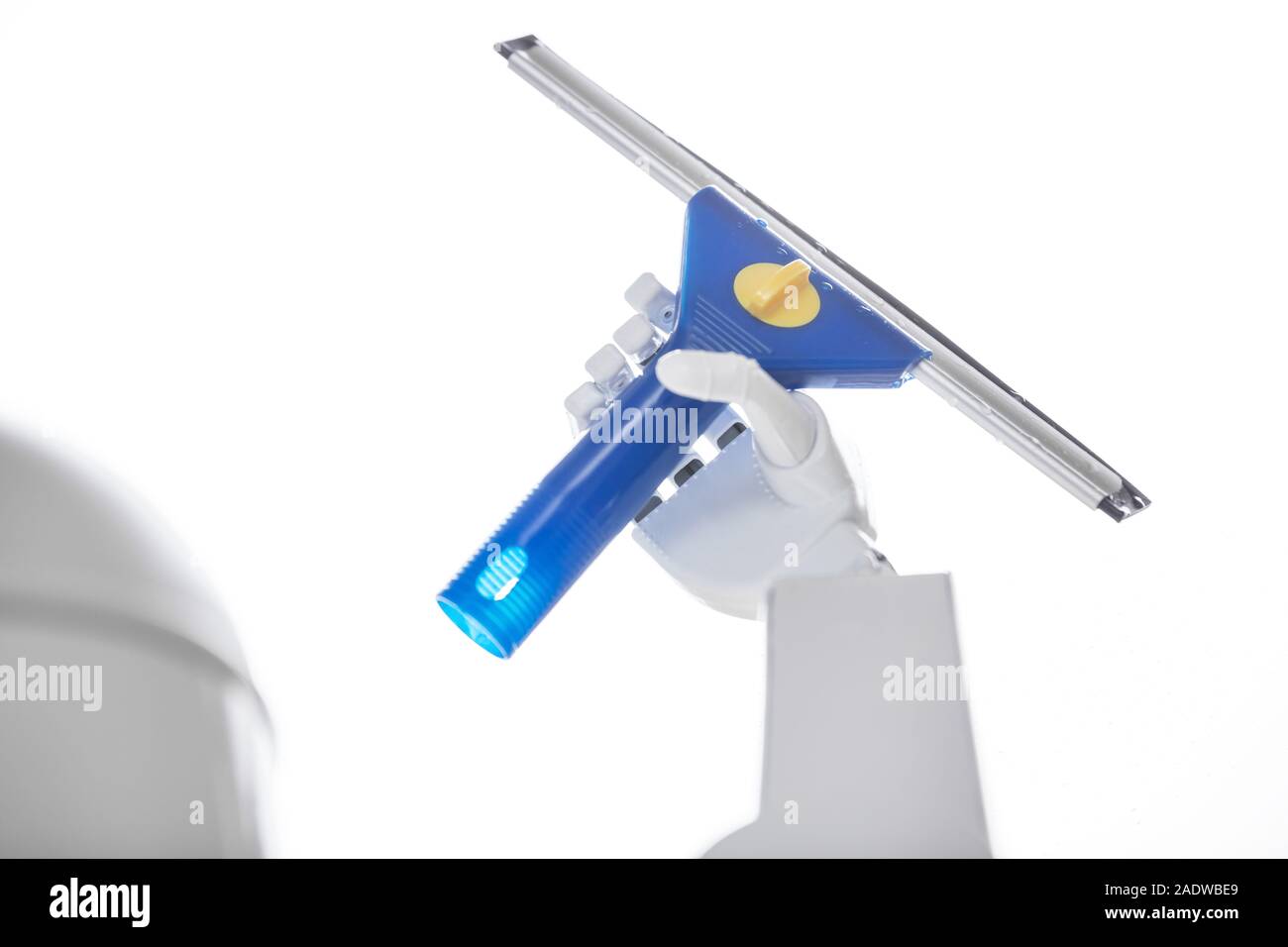 a autonomous robot is washing a window with a tool, using his robot ...