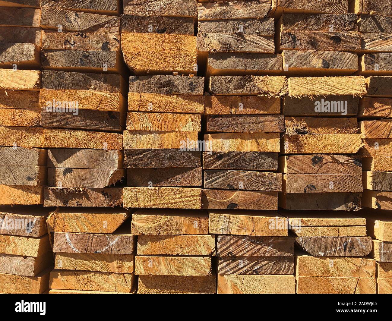Stack of lumber at the outdoor warehouse. Stockpiled edged boards Stock ...