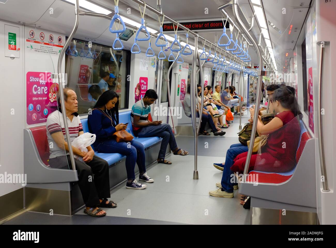 Singapore-25 FEB 2018:Indoor view of people in a rail commuters ride a ...