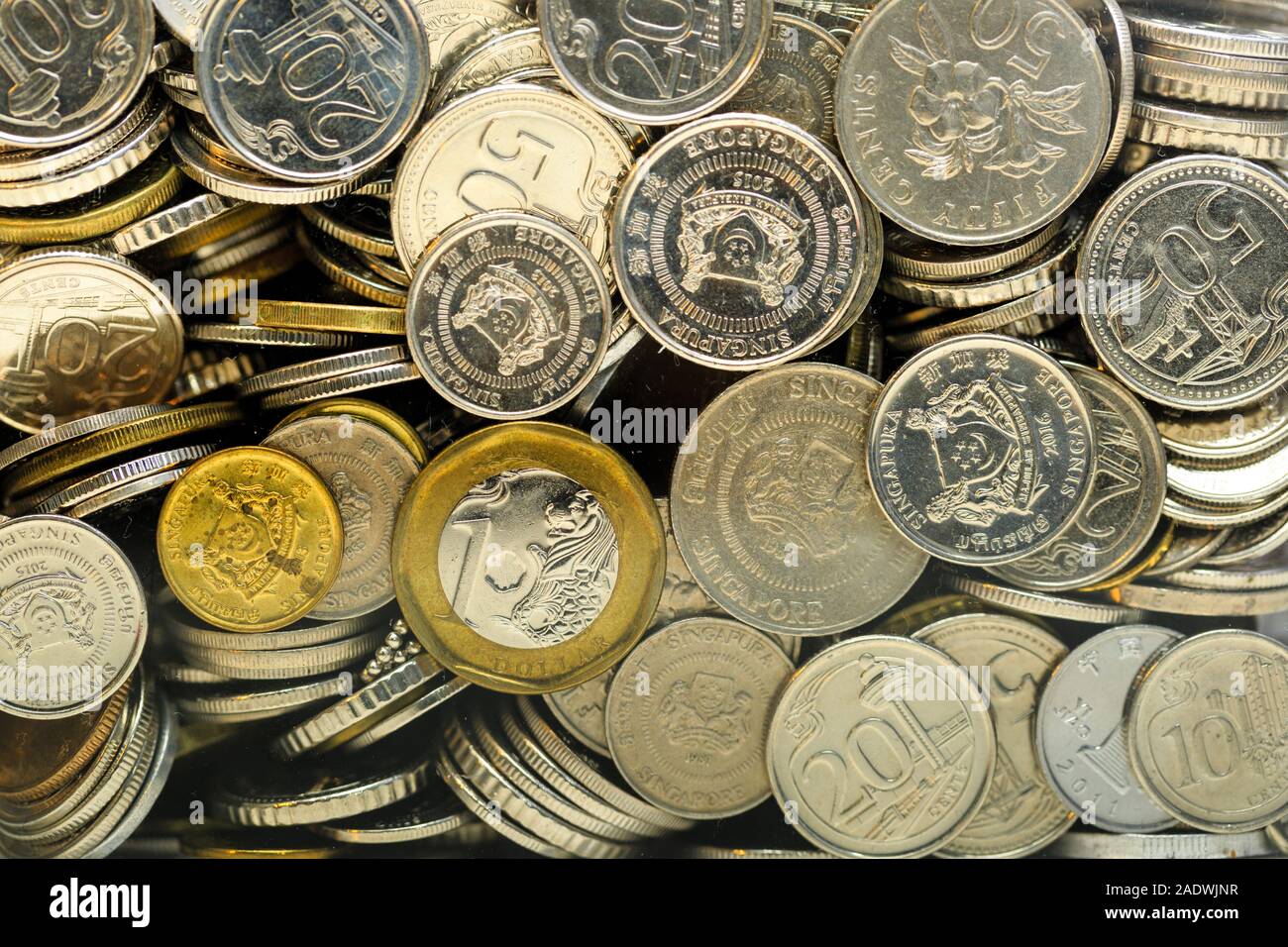 scattered coins of singapore background closeup view Stock Photo - Alamy