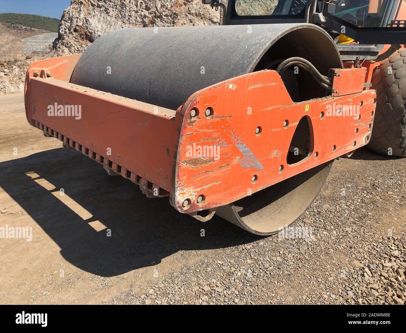 Vibrating roller compresses the soil of a road surface during road ...
