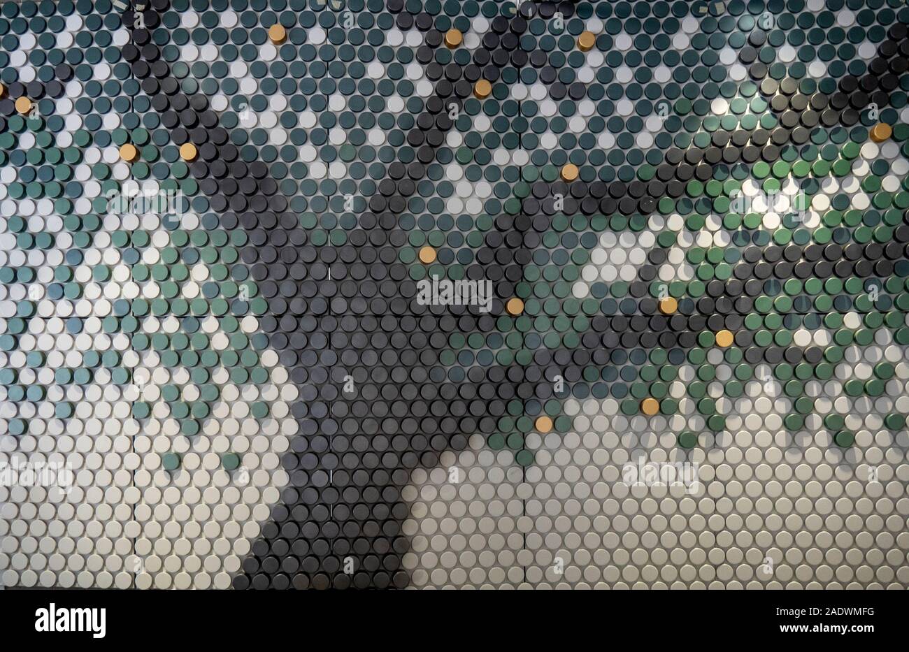 Round circular tile cladding on a wall of an office building forming ...