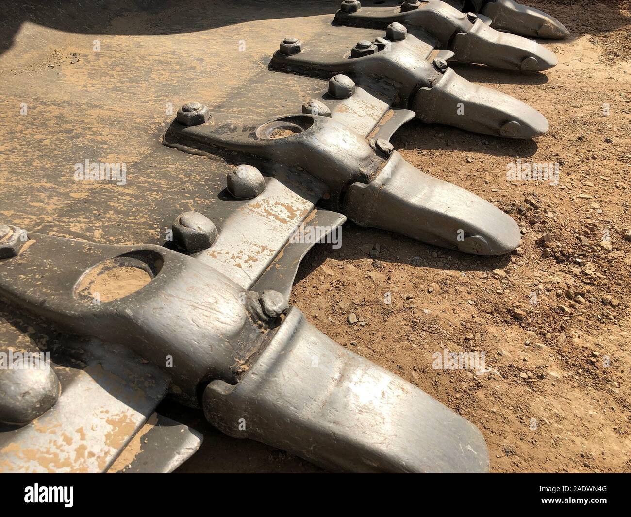Close up of crawler bulldozer bucket teeth. Earthmoving heavy machinery ...