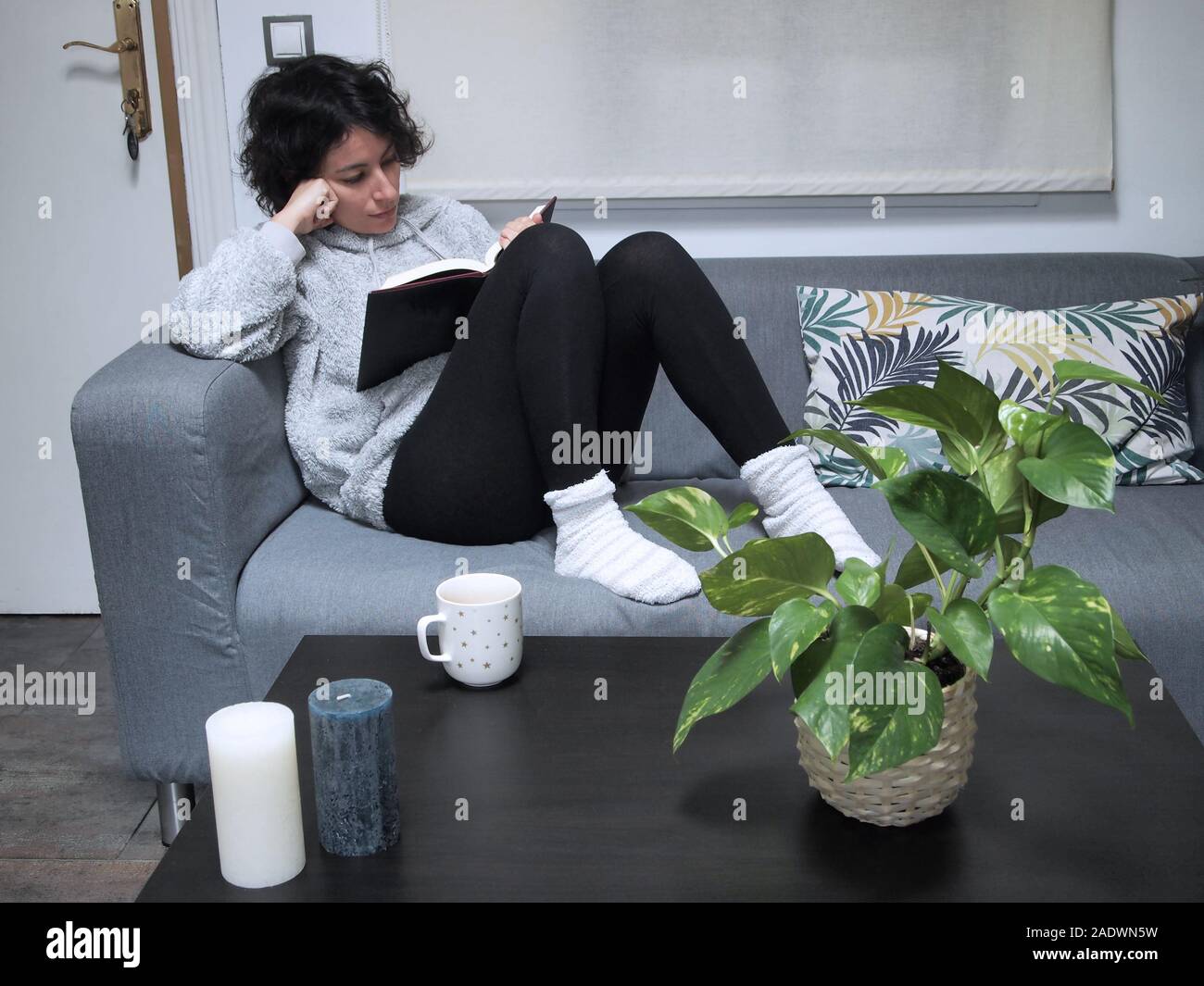 Woman socks couch hi-res stock photography and images - Alamy