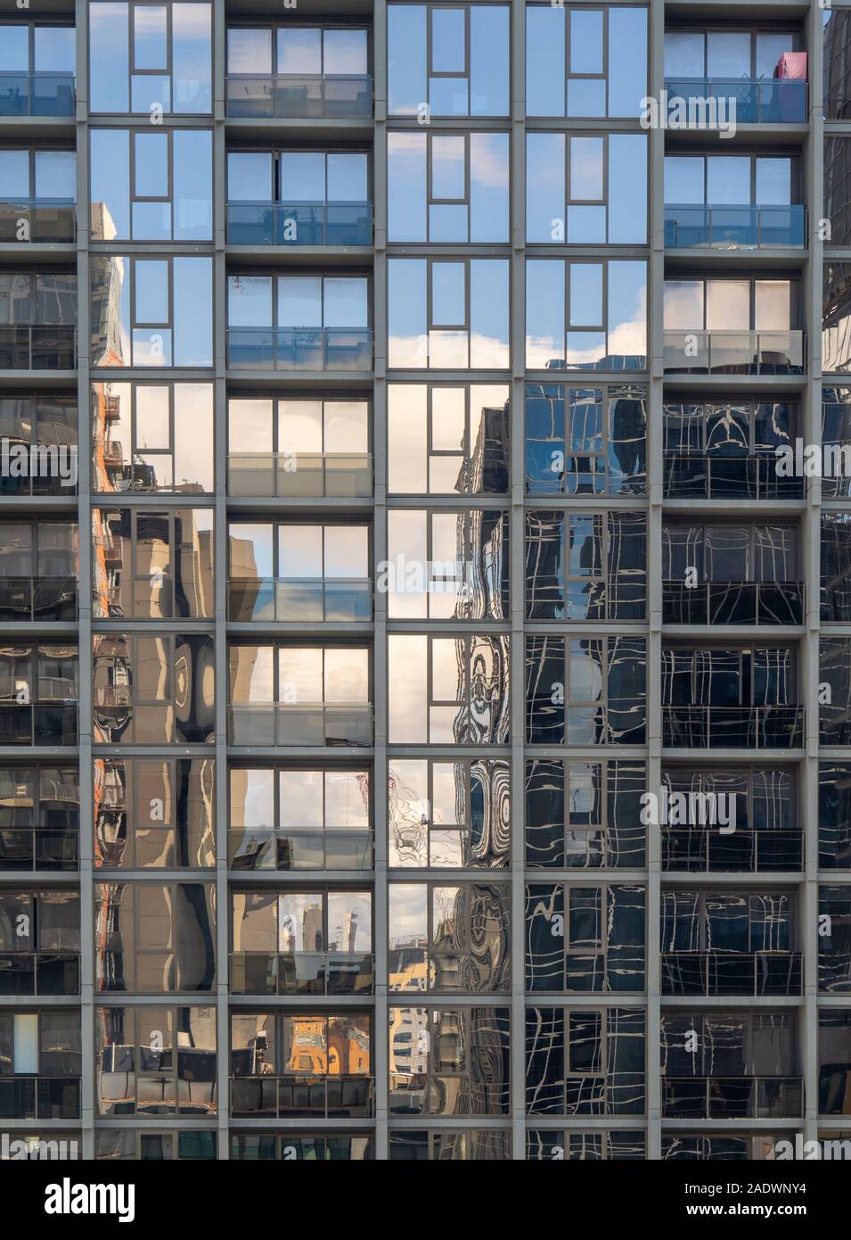 Reflections from glass facade of residential tower Stock Photo - Alamy Reflections from glass facade of residential tower Stock Photo - Alamy