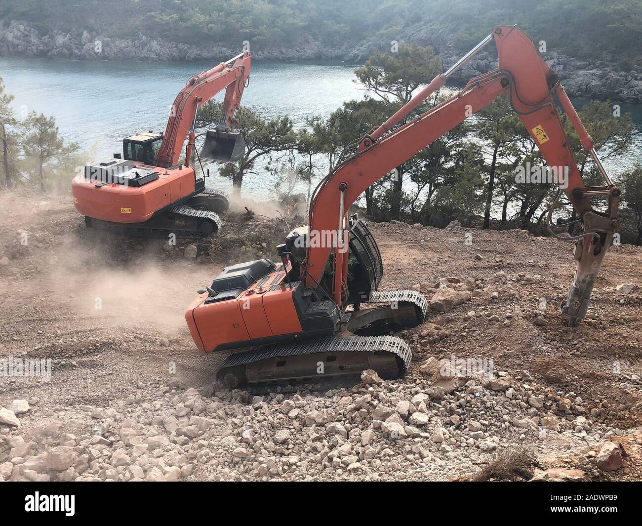 Hydrohammer is crushing rocks during road construction works on the ...
