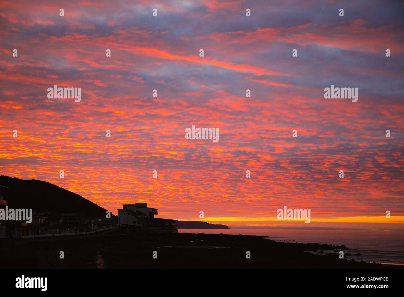red sunset over westward ho in devon uk Stock Photo - Alamy