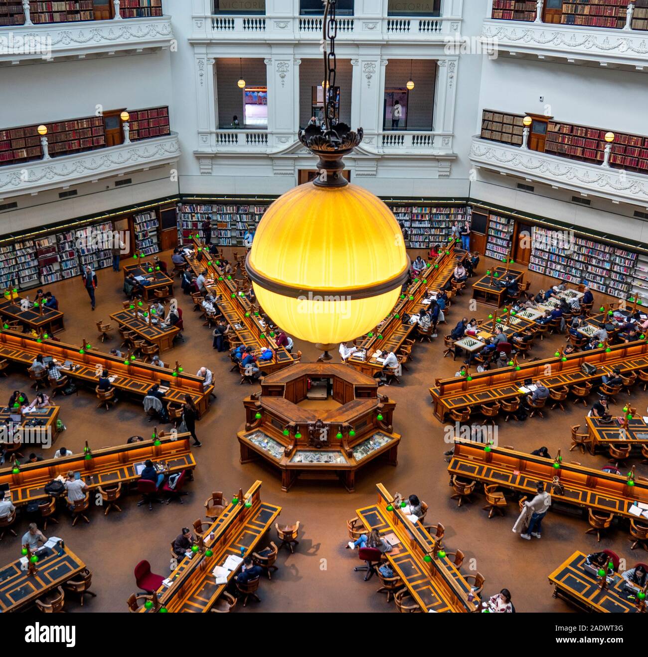 Large spherical light hanging over students studying in the La Trobe ...