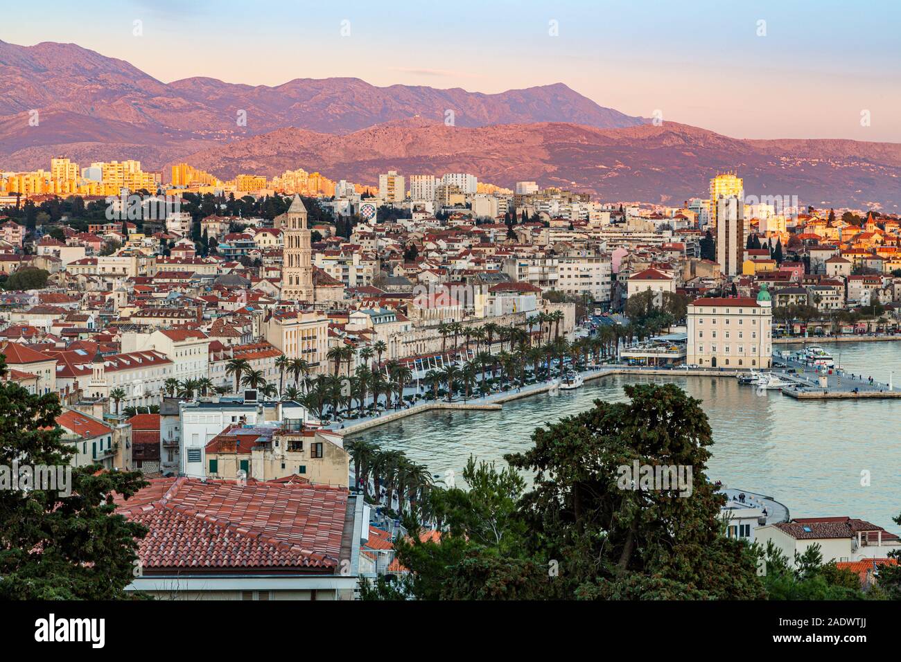 An aerial elevated evening twilight sunset view of the Riva waterfront ...