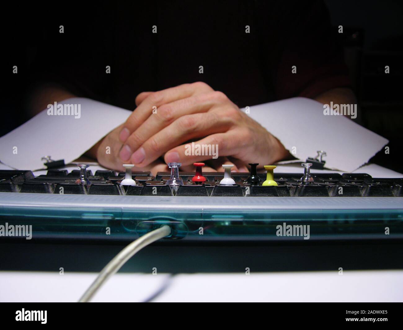 Man's hands in paper cuffs fastened with metal clips Stock Photo - Alamy