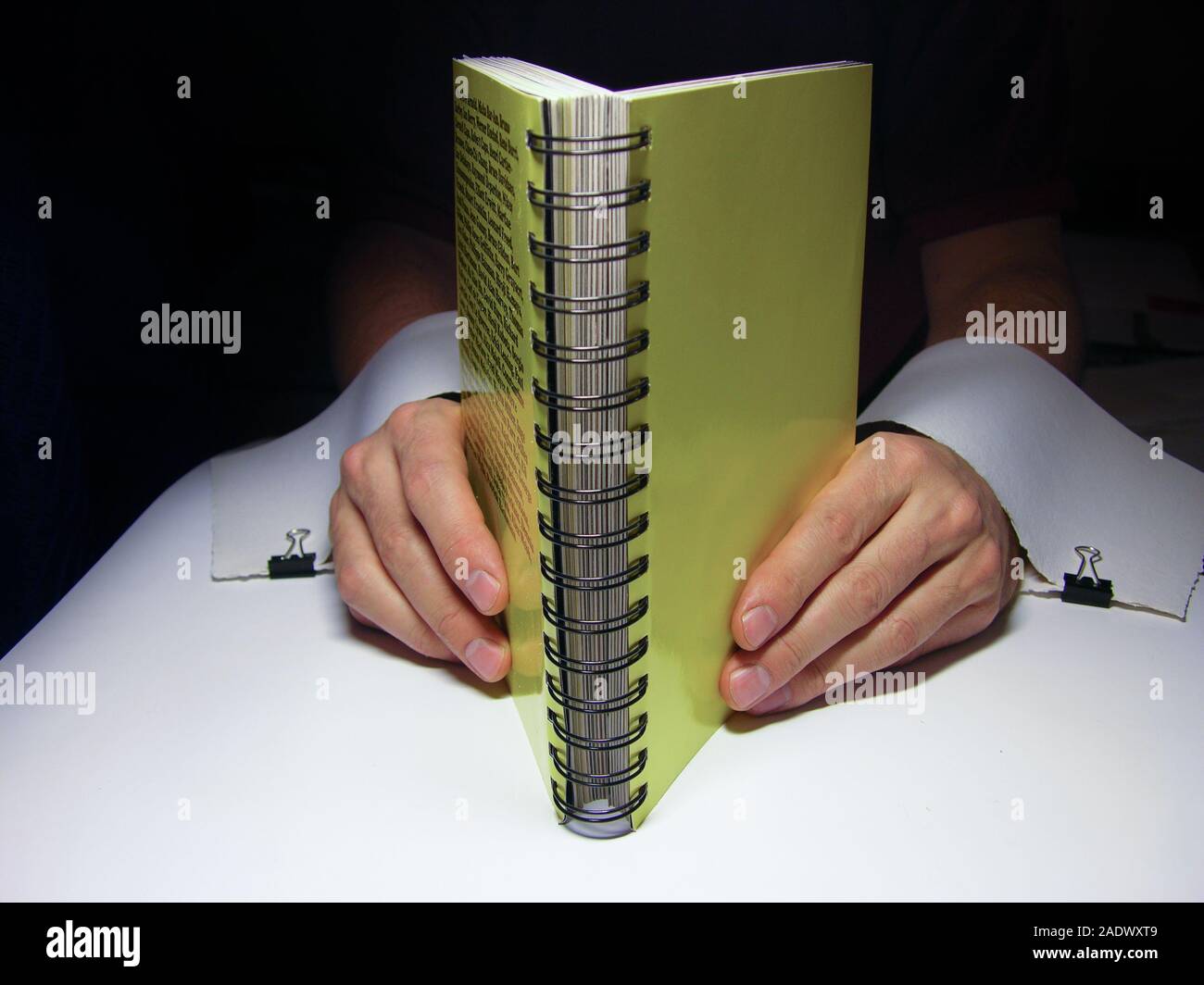 Man's hands in paper cuffs fastened with metal clips Stock Photo - Alamy