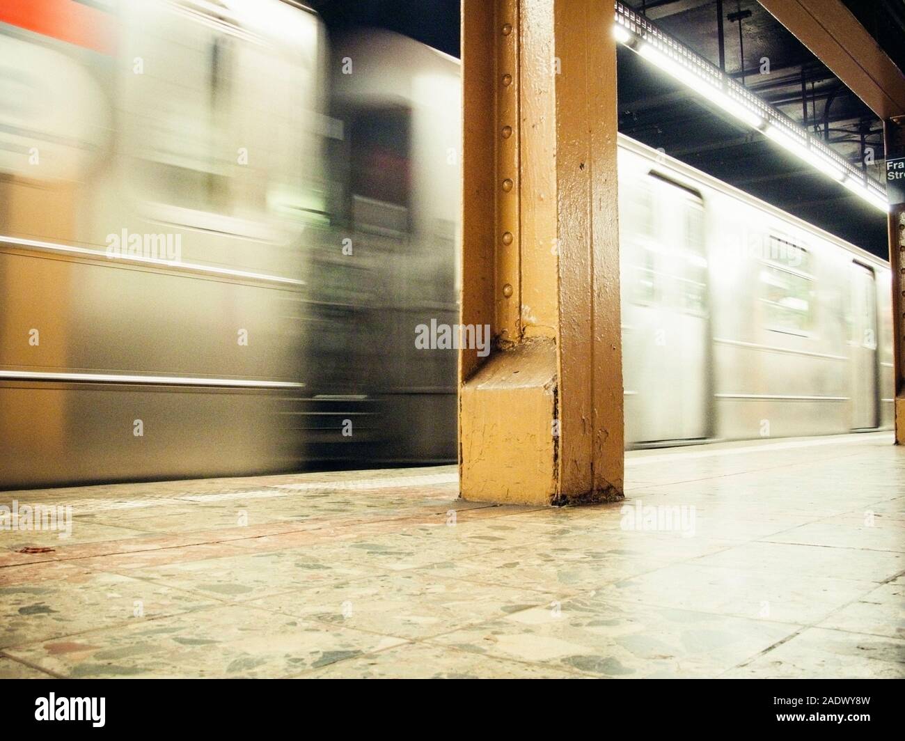 Interior view of subway moving through station in NYC Stock Photo - Alamy