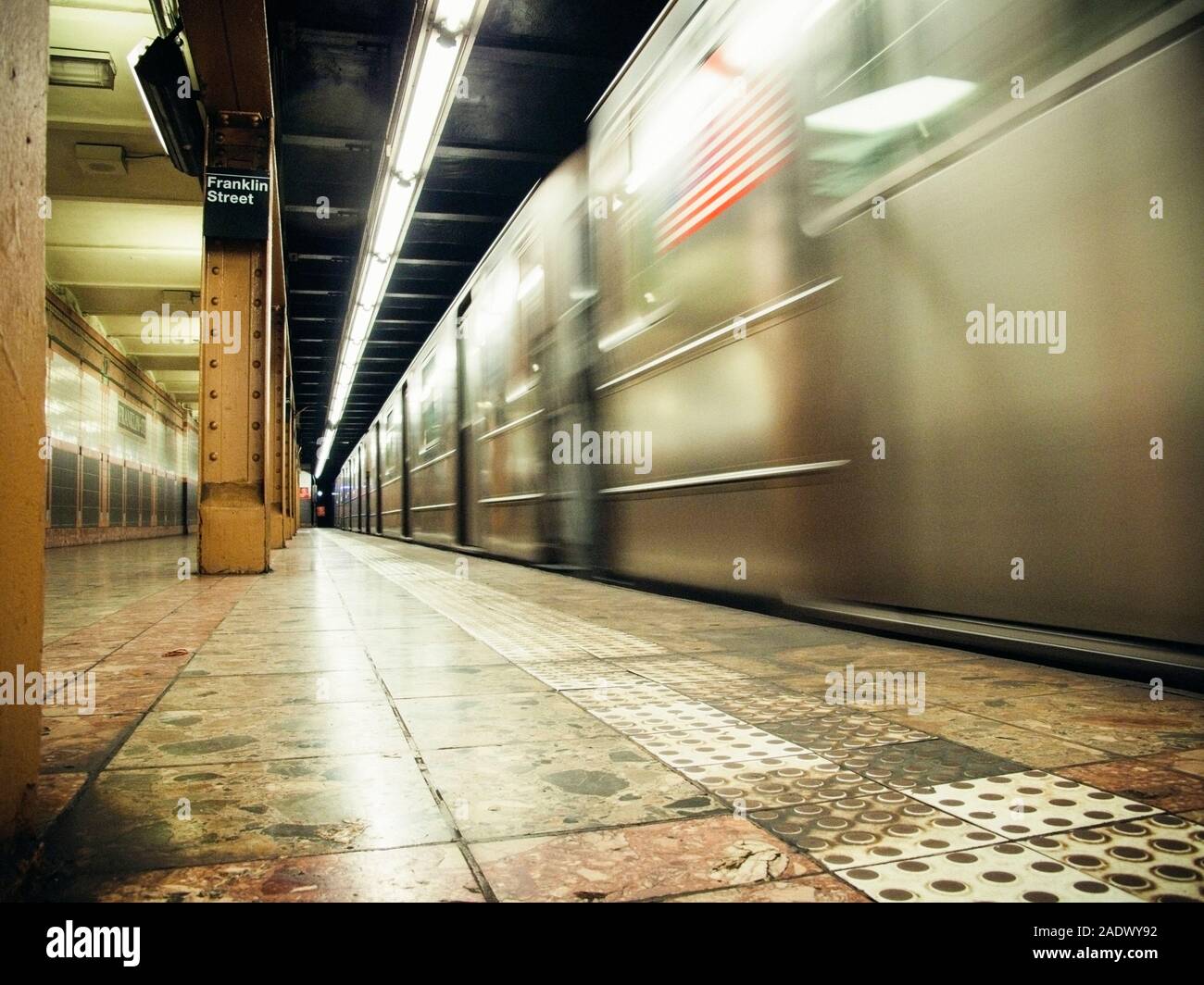 Interior view of subway moving through station in NYC Stock Photo - Alamy