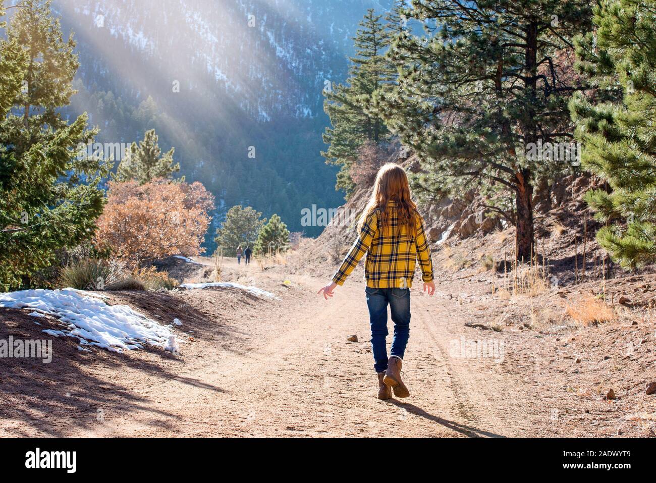 Girl Walking Down A Path