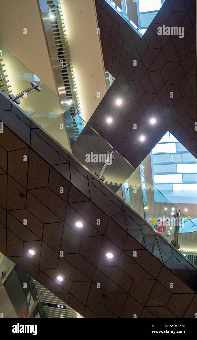 Underside of pedestrian bridges across multiple levels in atrium in ...
