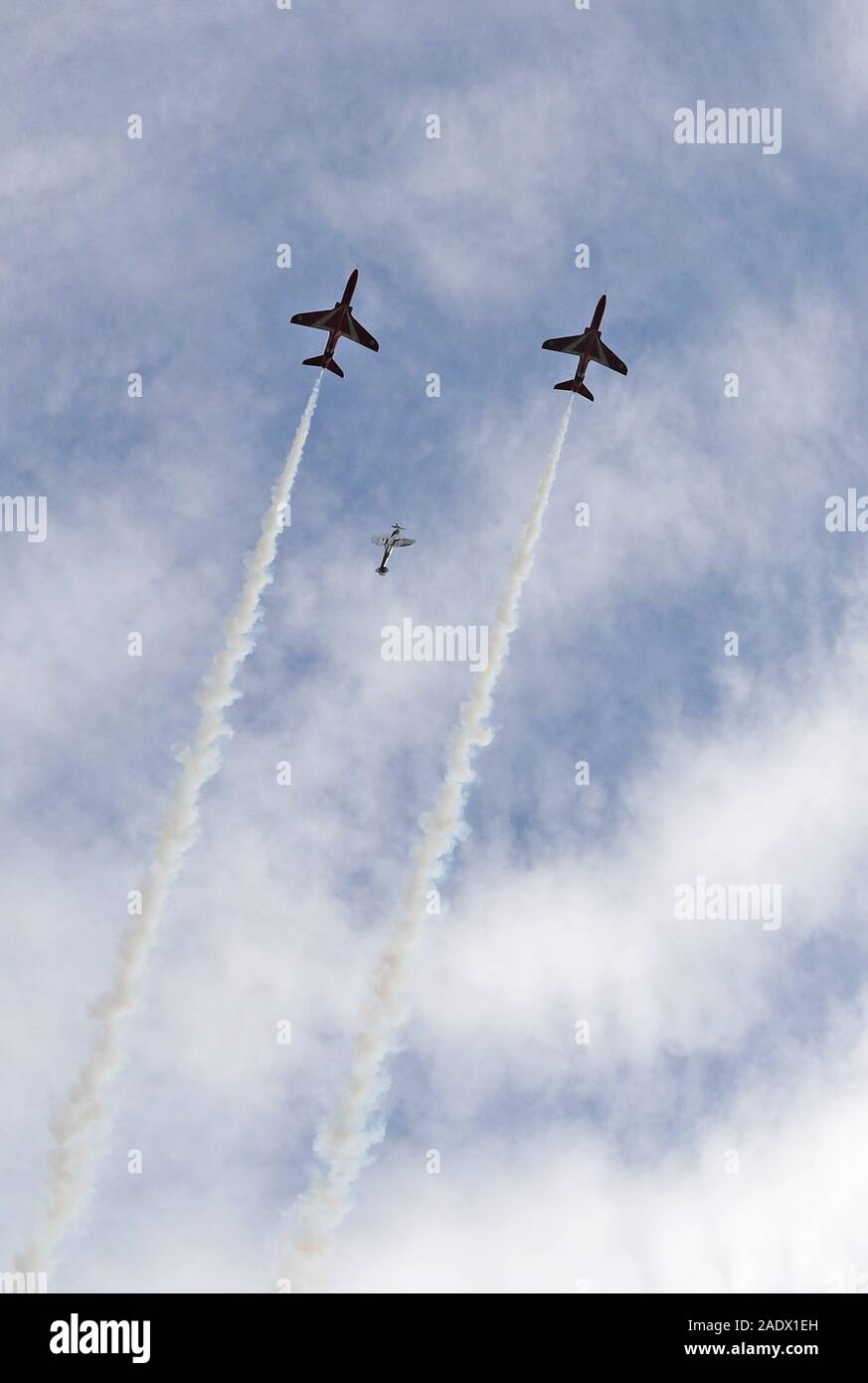 The IWC MK IX Silver Spitfire flanked by two RAF Red Arrows, arrives at ...