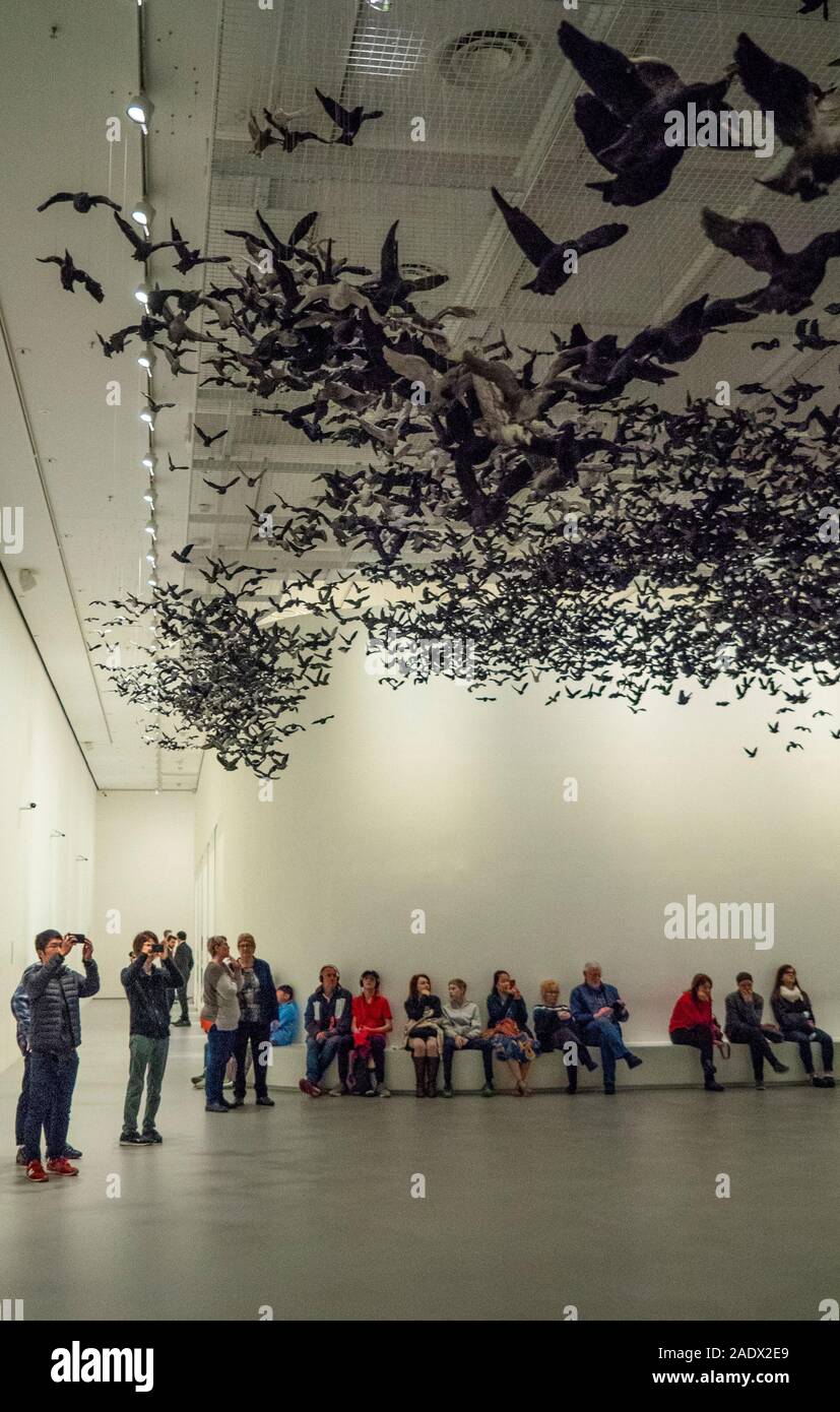 People viewing 10,000 suspended porcelain birds Murmuration (Landscape ...