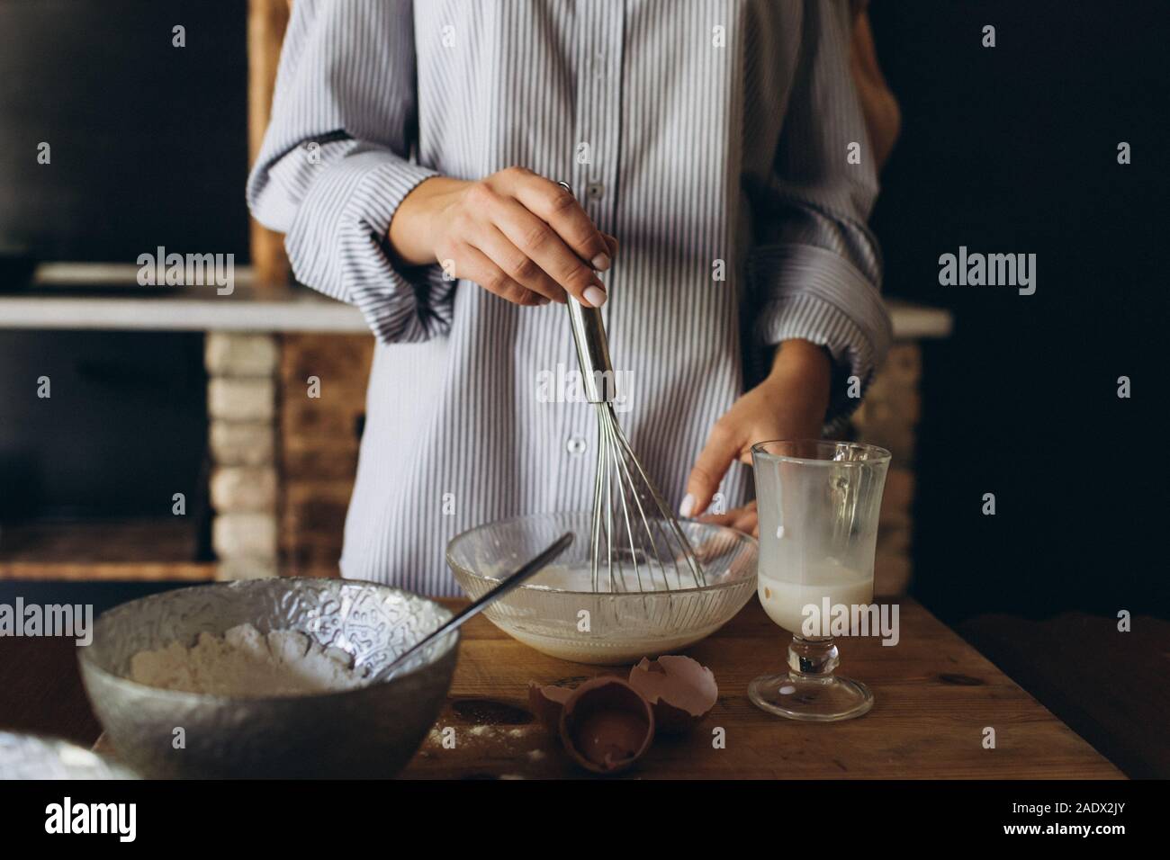 The process of cooking in the kitchen made of wood Stock Photo - Alamy