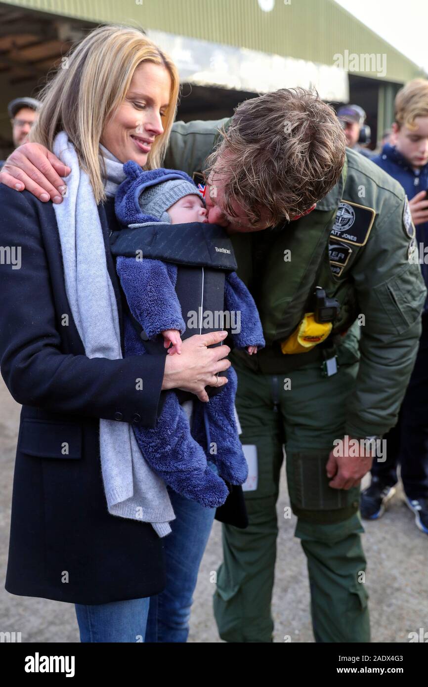 British pilot Matt Jones is greeted by his partner Nikkolay James and ...