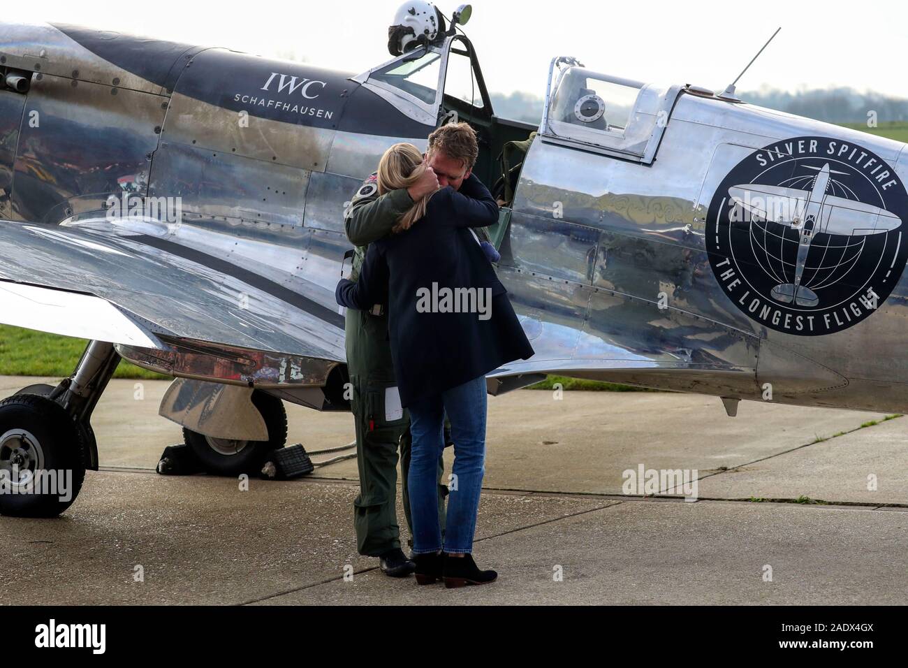 British pilot Matt Jones is greeted by his partner Nikkolay James and ...