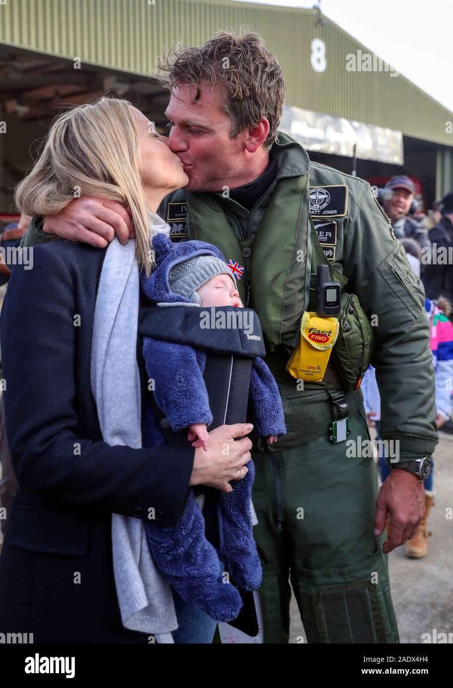 British pilot Matt Jones is greeted by his partner Nikkolay James and ...