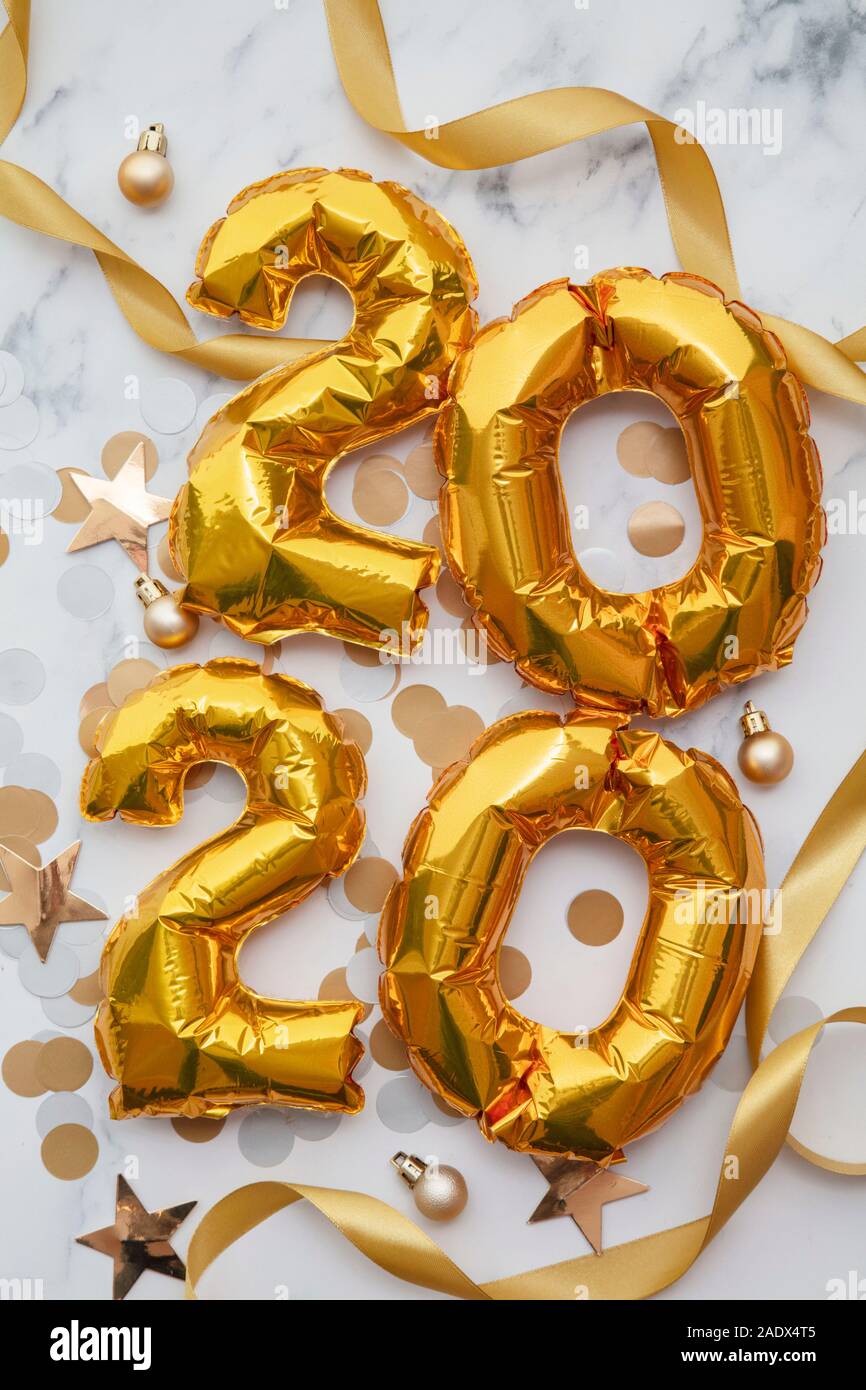 New Year 2020 celebration. Gold foil party balloons with decorations ...