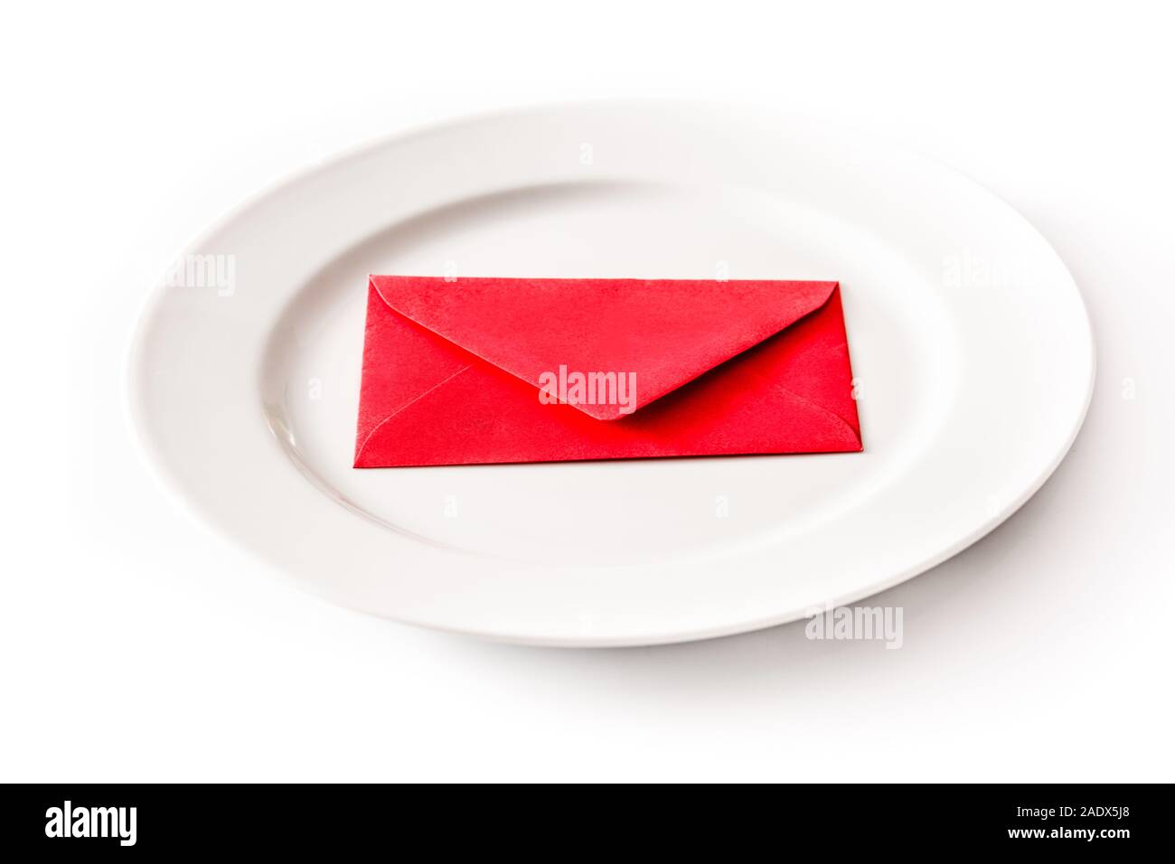 White plate surrounded with paper envelope on white background Stock ...