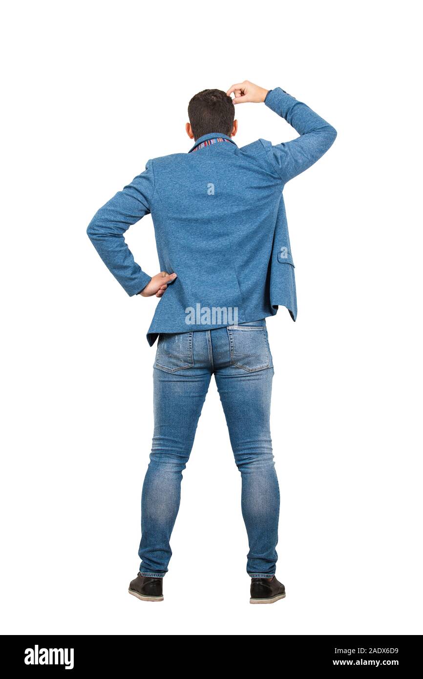 Rear view full length of confused young businessman, hand to head ...