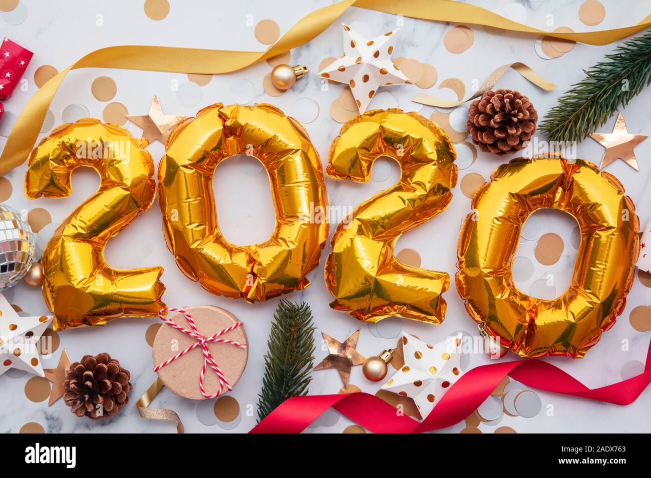 Festive 2020 celebration. Gold foil party balloons with decorations ...