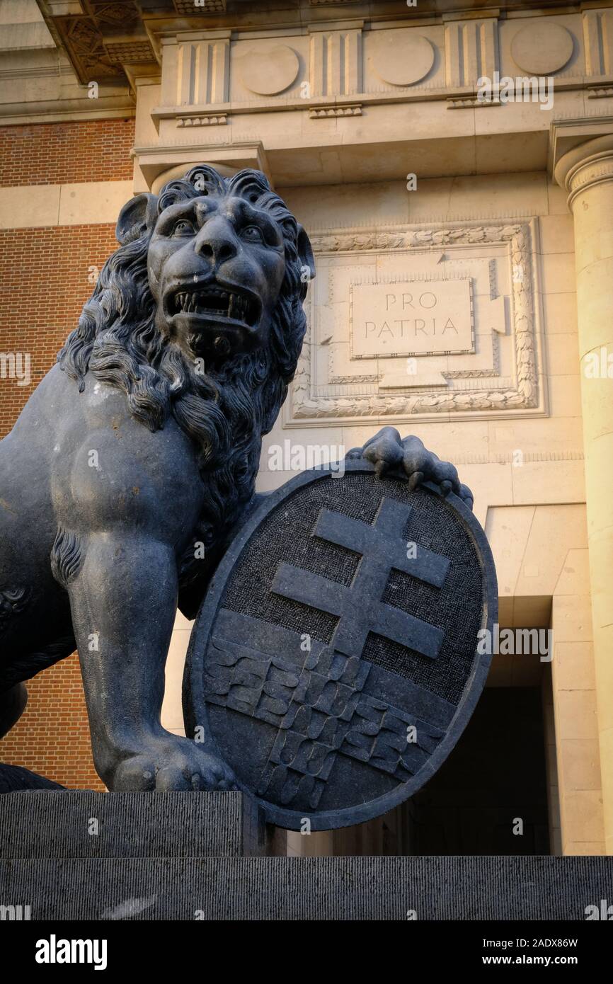 One of the lion statues in front of the Menin Gate Memorial to the ...