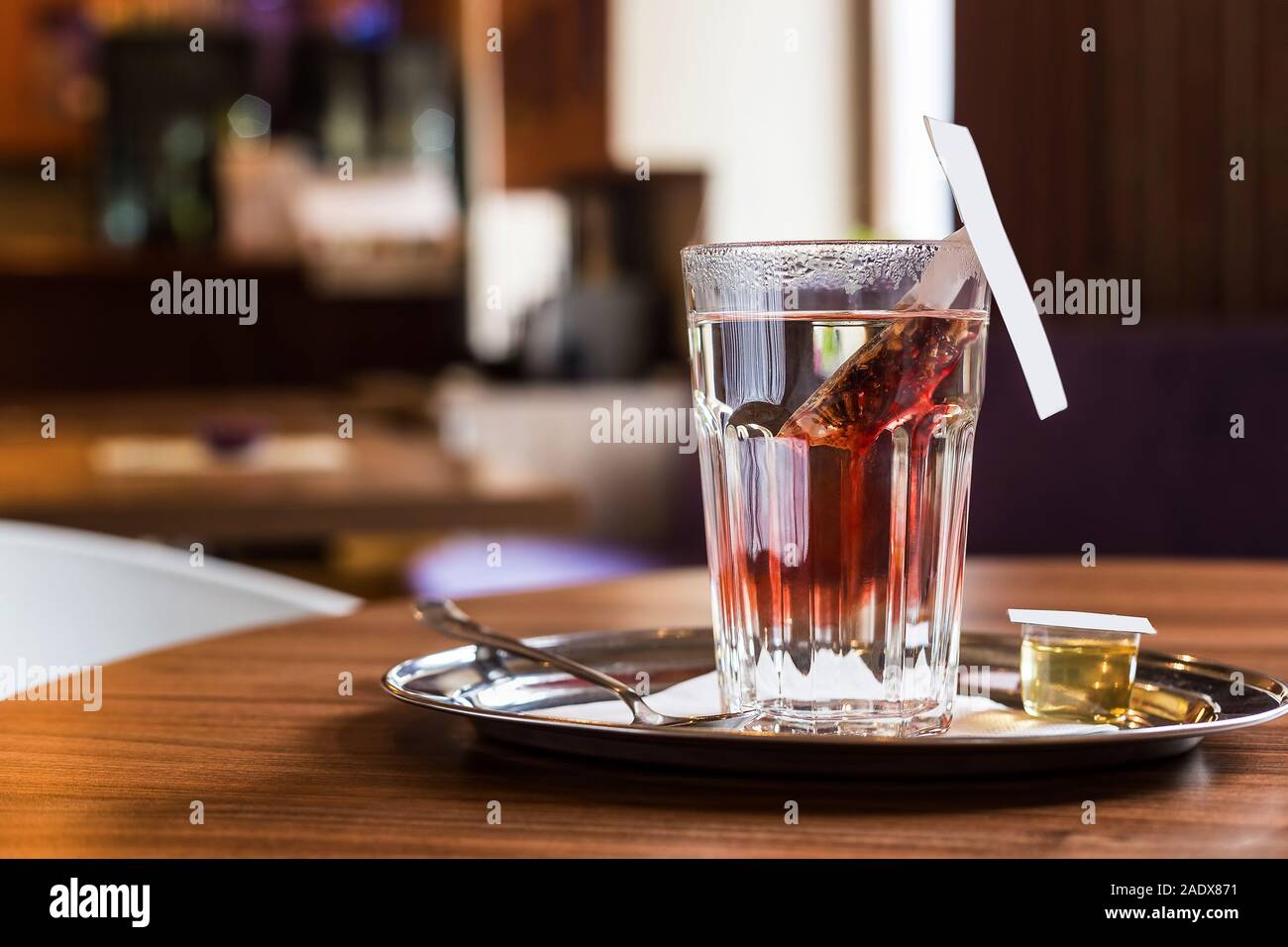 Red fruit tea in tearoom. Nobody.Waiting for friends Stock Photo - Alamy