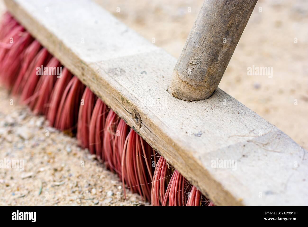 Sweep dirt with the broom Stock Photo - Alamy