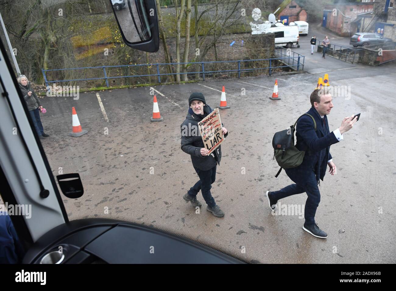 A protester stands by Prime Minister Boris Johnson's battle bus as he ...
