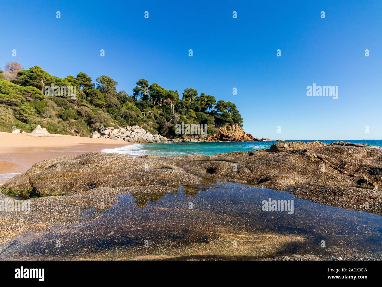 Reflections, sun and sand on this beach of the Catalan coast Stock ...