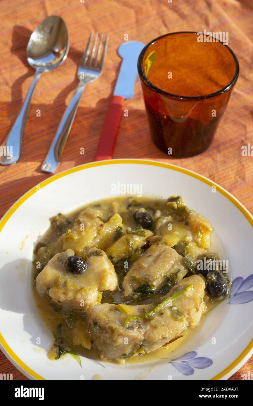 stewed cod at the mediterranean with black olives and onion Stock Photo ...